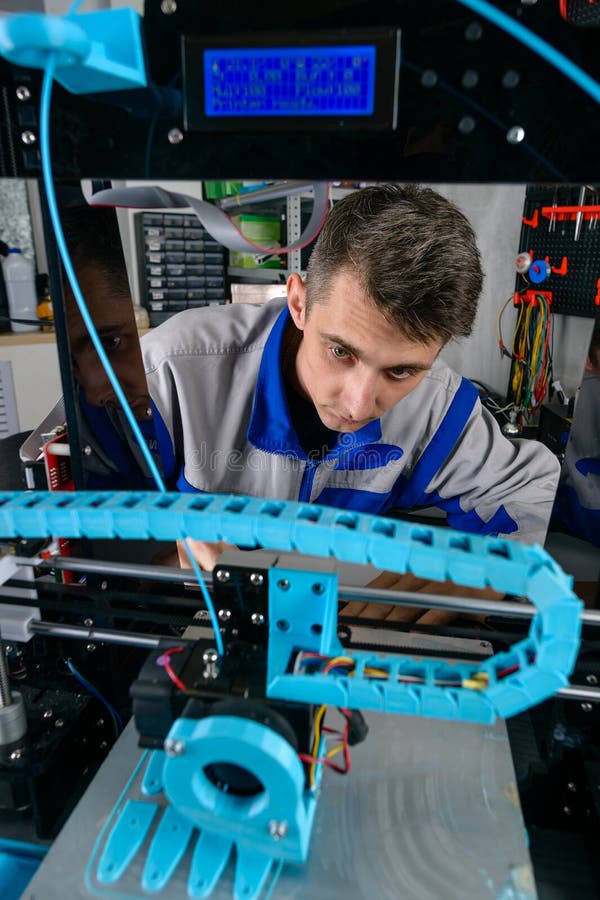 Young Designer Engineer Using a 3D Printer in Laboratory Stock Photo ...