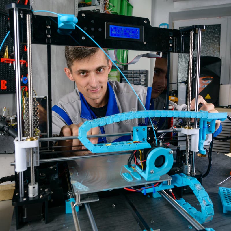 Young Designer Engineer Using a 3D Printer in Laboratory Stock Photo ...