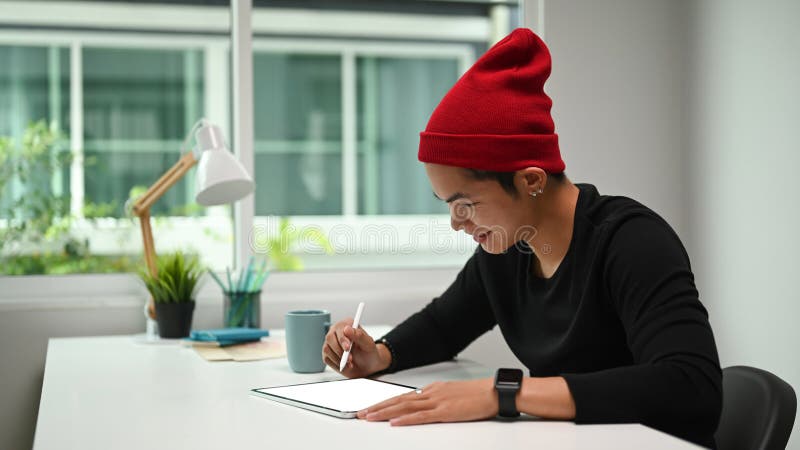 Young Designer Using Stylus Pen Drawing Sketches on Graphic Tablet ...