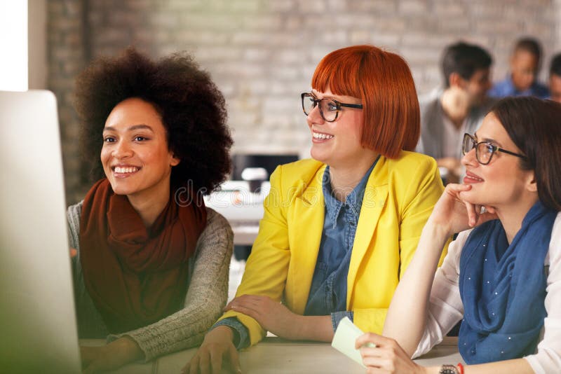 Young Designers Having Fun while Working Together on Joint Project ...