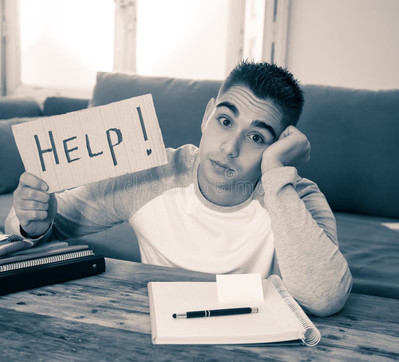Young Desperate Student in Stress Working and Studying Holding a Help ...