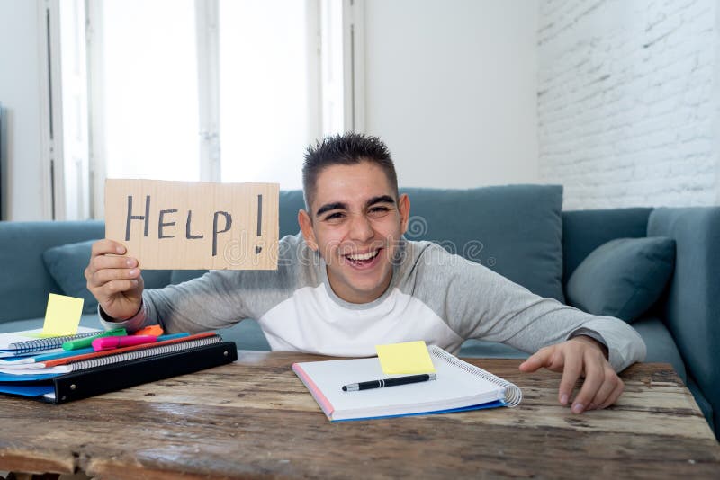 Young Desperate Student in Stress Working and Studying Holding a Help ...