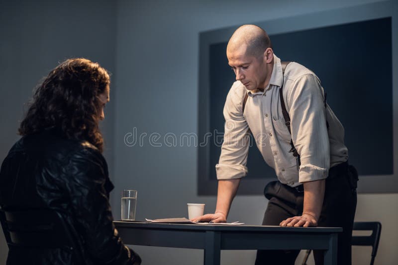 A Young Detective Interviews a Suspect in a Crime Stock Photo - Image ...