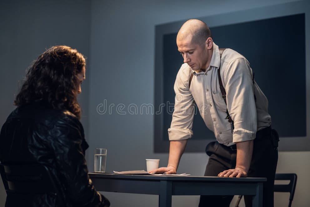 A Young Detective Interviews a Suspect in a Crime Stock Photo - Image ...