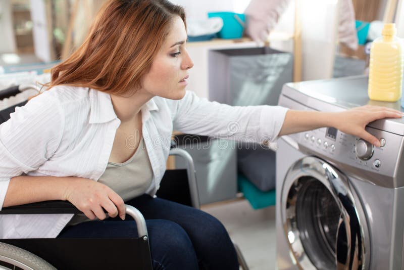 Young Disable Woman Putting Washing Machine on Stock Image - Image of ...