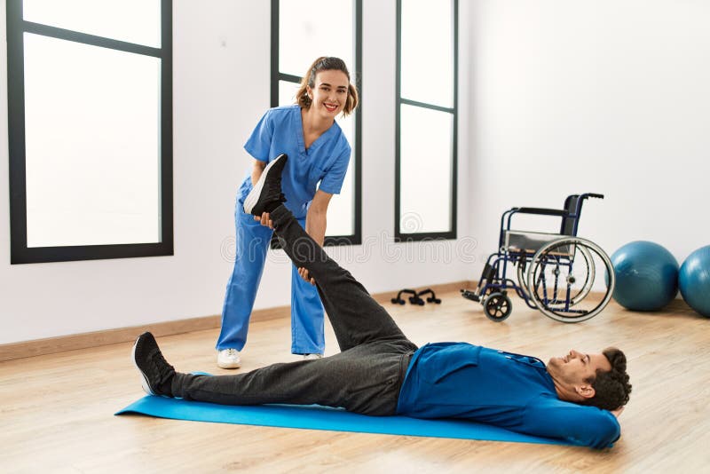 Young Disabled Man Making Mobility Exercise at the Clinic Stock Photo ...