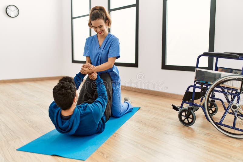 Young Disabled Man Making Mobility Exercise at the Clinic Stock Photo ...