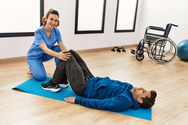 Young Disabled Man Making Mobility Exercise at the Clinic Stock Photo ...