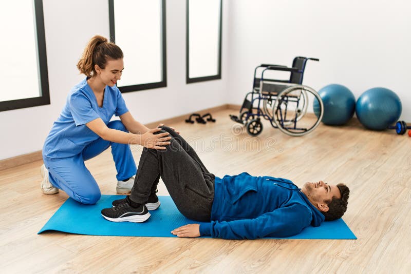 Young Disabled Man Making Mobility Exercise at the Clinic Stock Photo ...