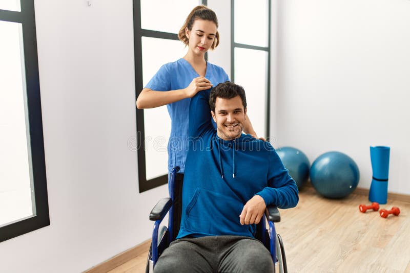 Young Disabled Man Making Mobility Exercise Sitting on Wheelchair at ...