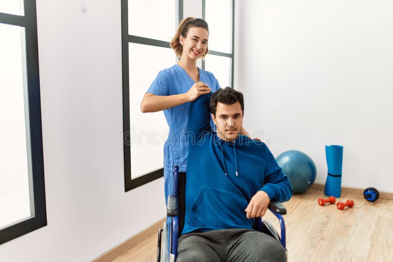 Young Disabled Man Making Mobility Exercise Sitting on Wheelchair at ...