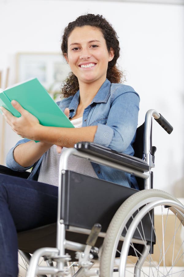 Young Disabled Woman in Wheelchair with Book Stock Photo - Image of ...