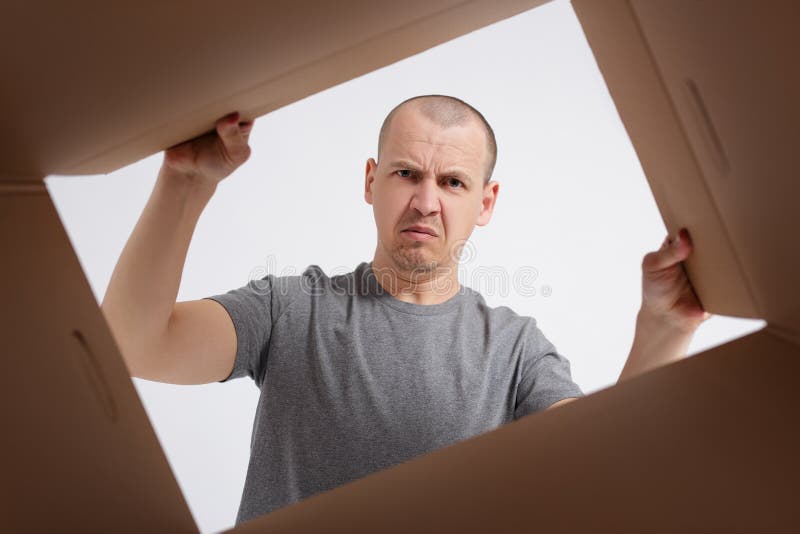 Young Disappointed Man Looking Inside the Box Stock Photo - Image of ...