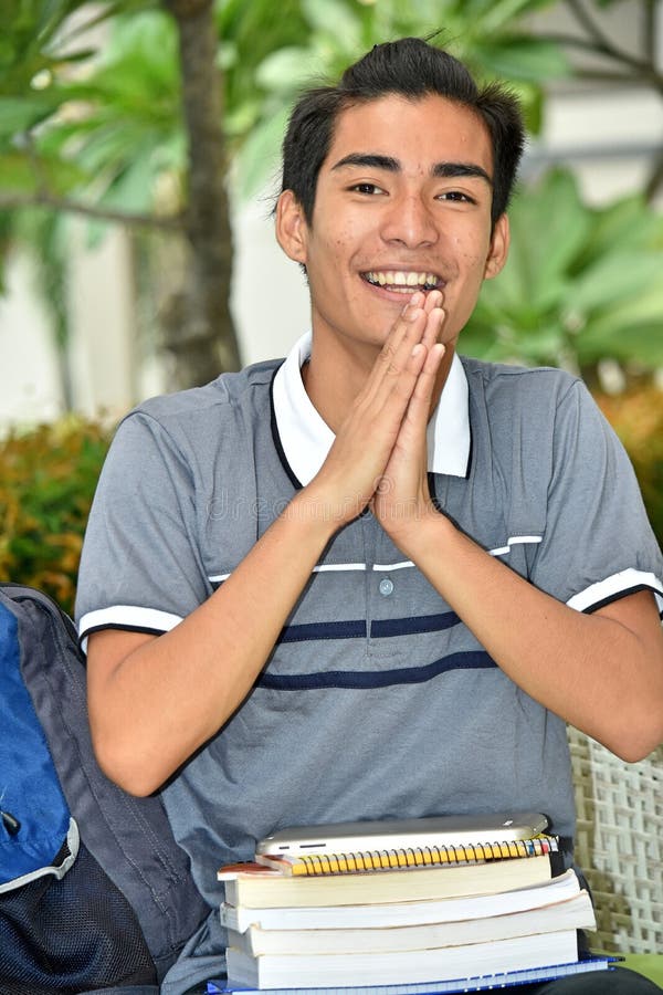 Young Diverse Boy Student in Prayer with Books Stock Photo - Image of ...