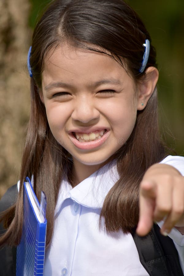 Young Diverse Female Student Pointing with Books Stock Image - Image of ...