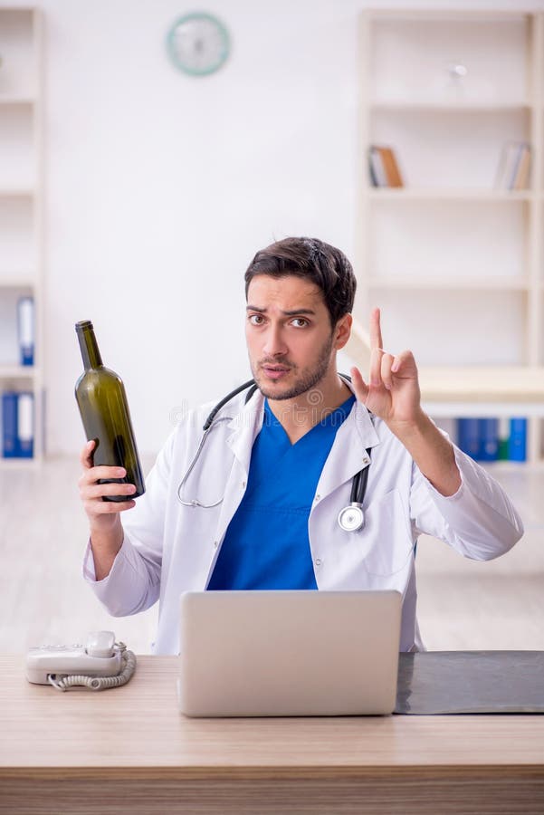 Young Male Doctor in Alcoholism Concept Stock Photo - Image of booze ...