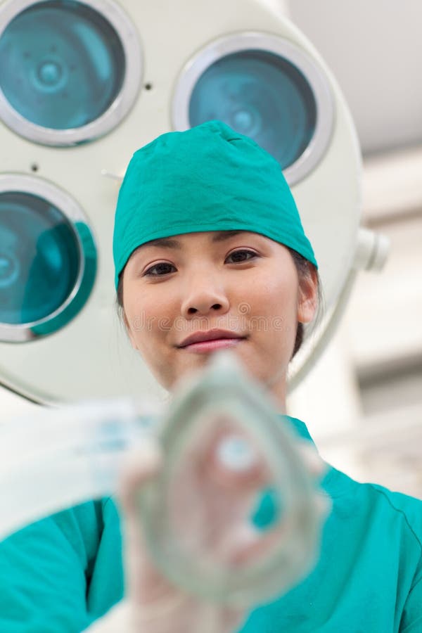 Young Doctor Applying Oxygen Mask To a Patient Stock Photo - Image of ...
