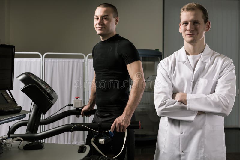 Young Doctor and Athletic Man Stock Photo - Image of training ...