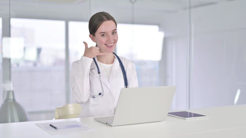 Young Doctor Doing Call Me Sign with Hand Stock Photo - Image of ...