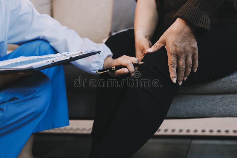 Young Doctor Examines Senior Patient& X27;s Leg Stock Photo - Image of ...