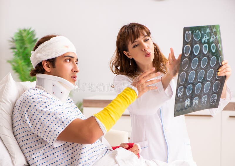 Young Doctor Examining Injured Patient Stock Photo - Image of injury ...