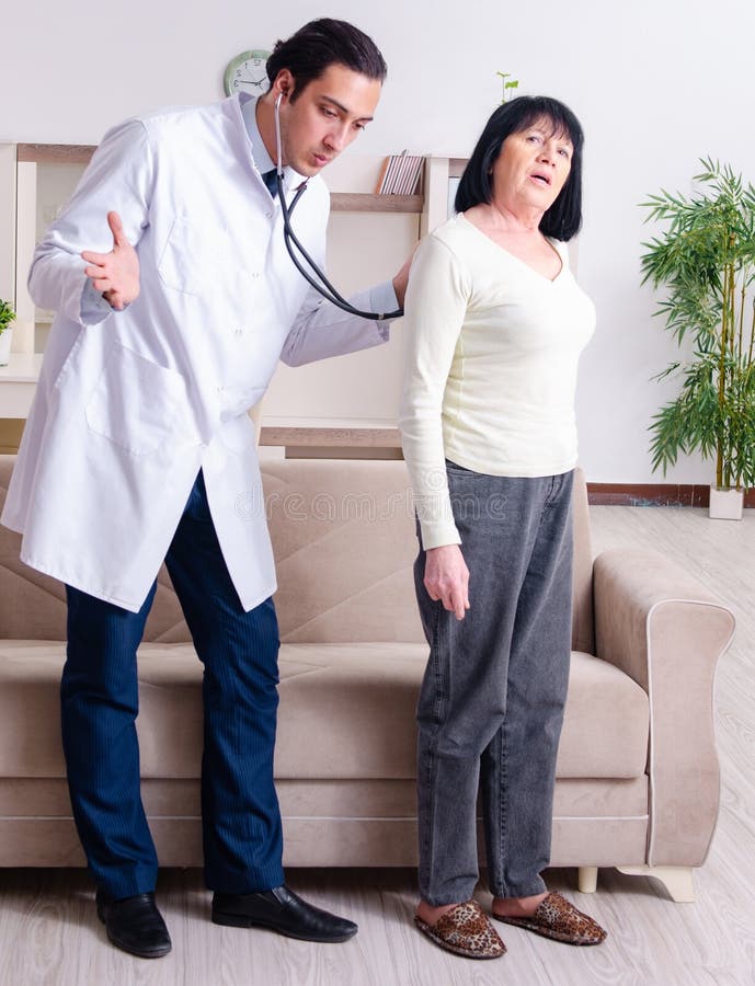 Young Doctor Examining Senior Old Woman Stock Photo - Image of ...