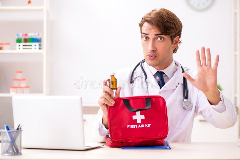 The Young Doctor with First Aid Kit in Hospital Stock Image - Image of ...