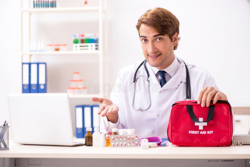 The Young Doctor with First Aid Kit in Hospital Stock Image - Image of ...