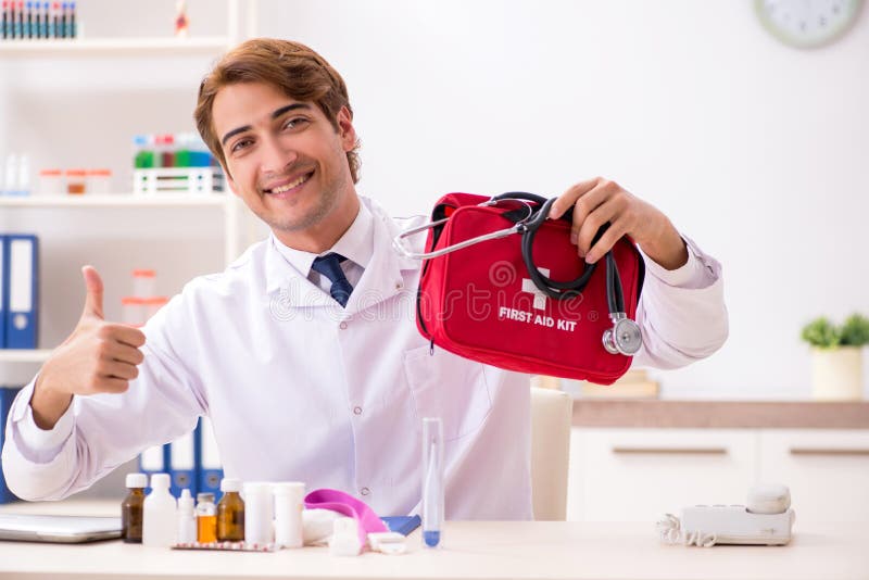 The Young Doctor with First Aid Kit in Hospital Stock Photo - Image of ...