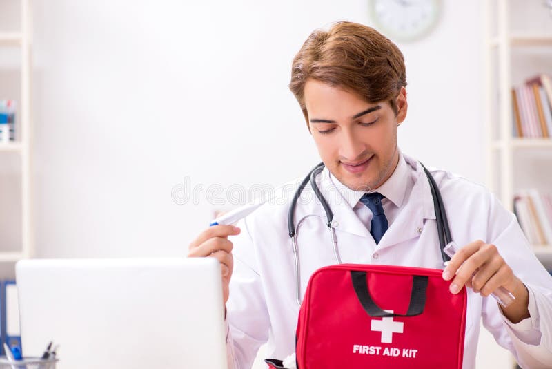 The Young Doctor with First Aid Kit in Hospital Stock Image - Image of ...
