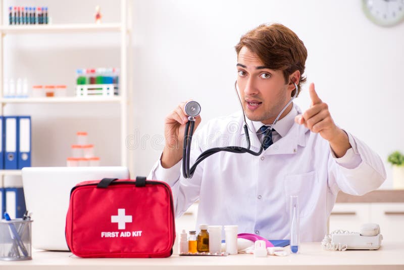 The Young Doctor with First Aid Kit in Hospital Stock Image - Image of ...