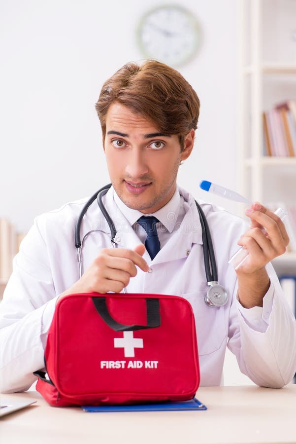 The Young Doctor with First Aid Kit in Hospital Stock Photo - Image of ...