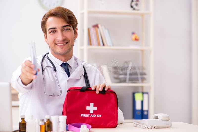 The Young Doctor with First Aid Kit in Hospital Stock Photo - Image of ...
