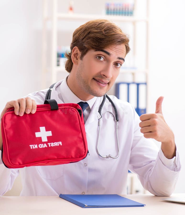 Young Doctor with First Aid Kit in Hospital Stock Image - Image of ...