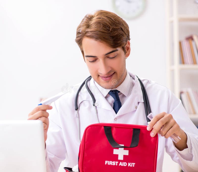 Young Doctor with First Aid Kit in Hospital Stock Photo - Image of ...