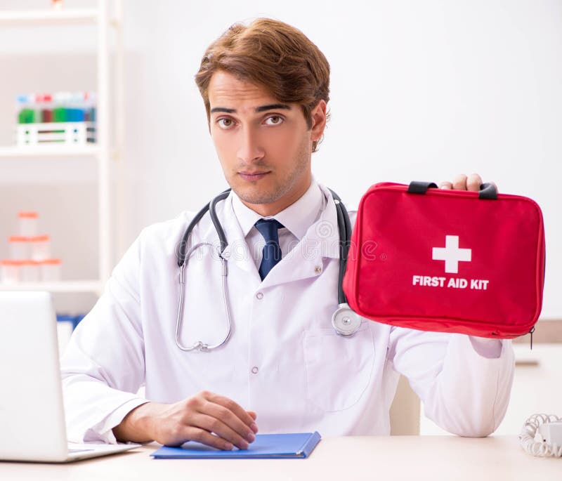 Young Doctor with First Aid Kit in Hospital Stock Photo - Image of ...
