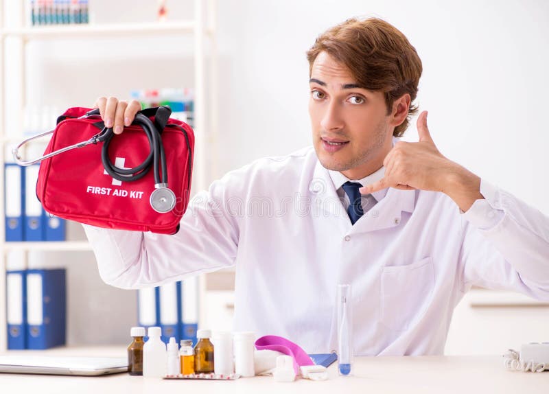 Young Doctor with First Aid Kit in Hospital Stock Image - Image of ...
