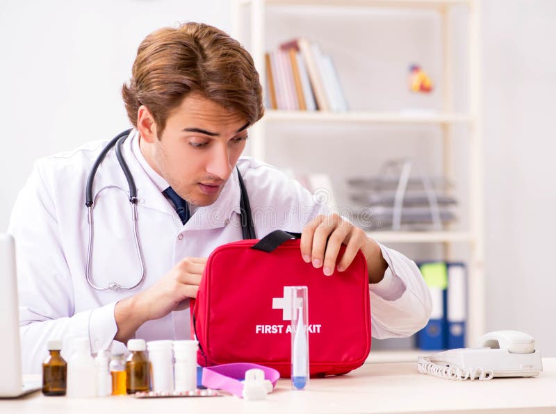 Young Doctor with First Aid Kit in Hospital Stock Image - Image of ...