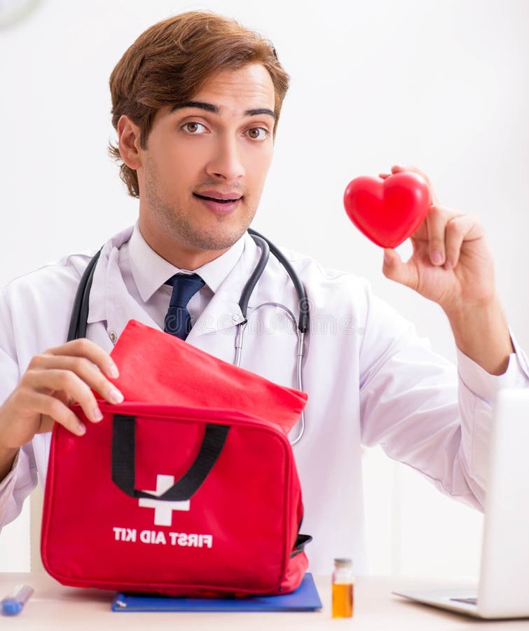 Young Doctor with First Aid Kit in Hospital Stock Image - Image of ...
