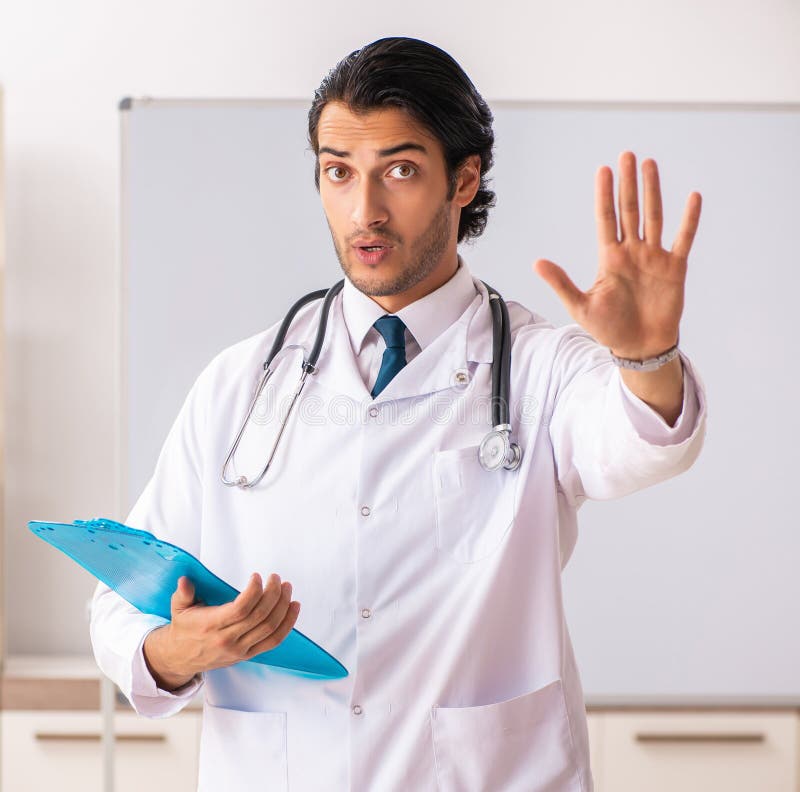 Young Doctor in Front of Whiteboard Stock Photo - Image of exam ...