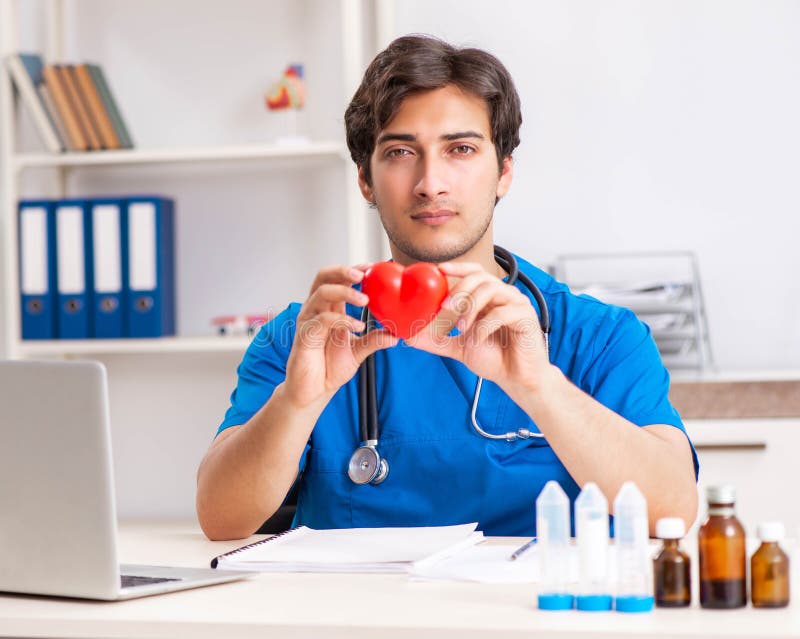 Young Doctor in Heart Care Concept Stock Photo - Image of concept, care ...