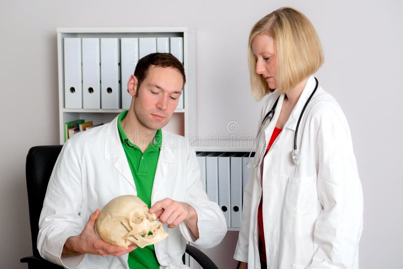 Young Doctor in Her Office with Skull Stock Photo - Image of ...