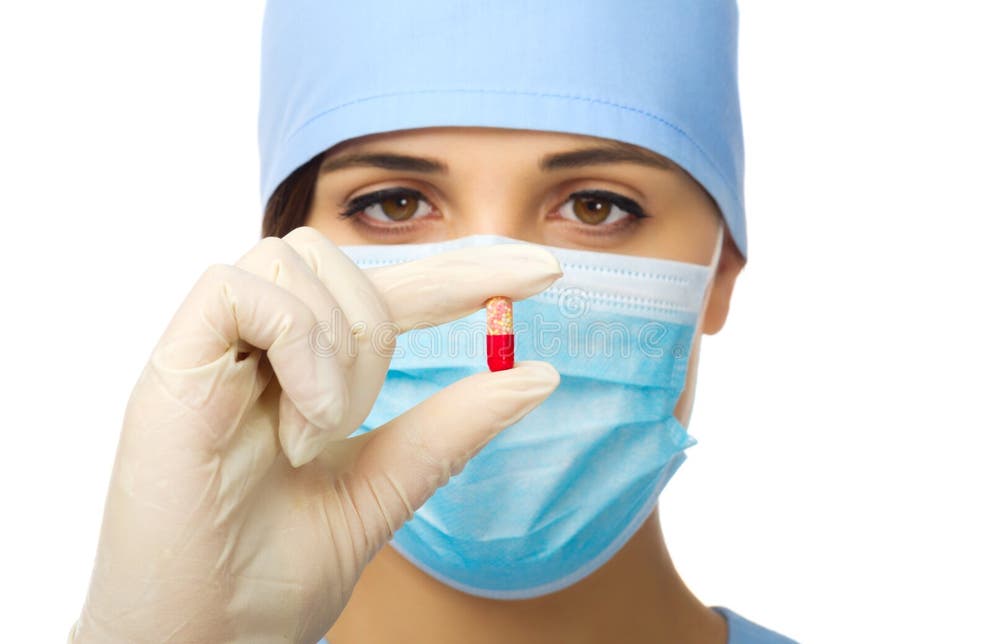 Young Doctor Holding Red Pill Stock Photo - Image of cheerful, doctor ...