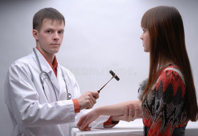 Young Doctor Inspecting Patient S Nervous System Stock Photo - Image of ...