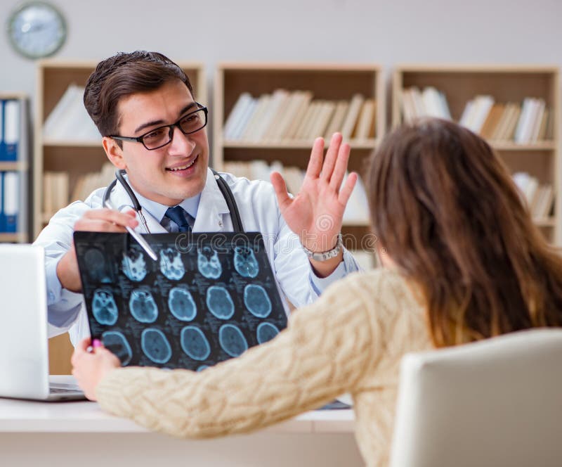 Young Doctor Looking at Computer Tomography X-ray Image Stock Image ...