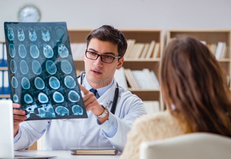 Young Doctor Looking at Computer Tomography X-ray Image Stock Image ...