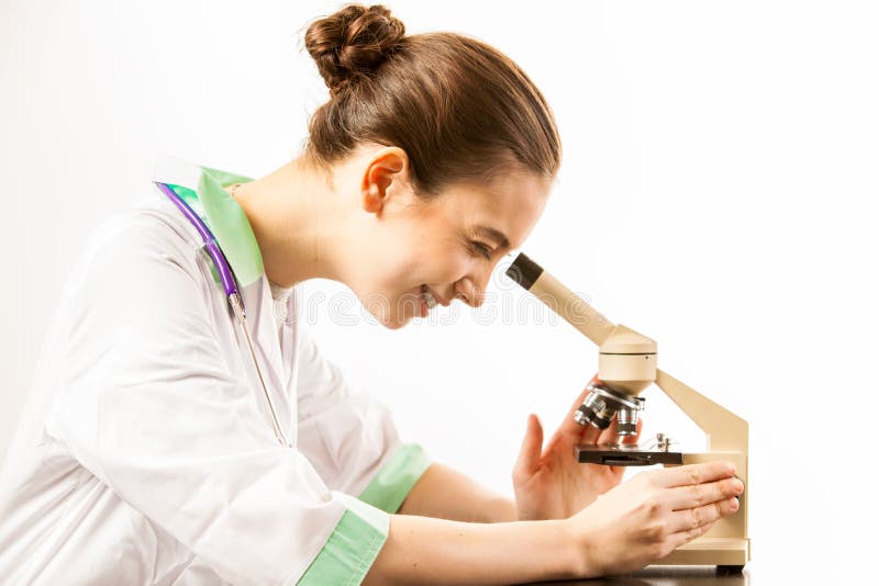 Young Doctor Looking into a Microscope Stock Photo - Image of analysis ...