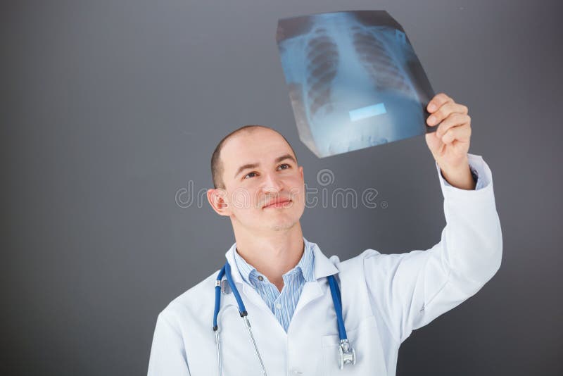Young Doctor Looking at Xray. Stock Image - Image of internship ...
