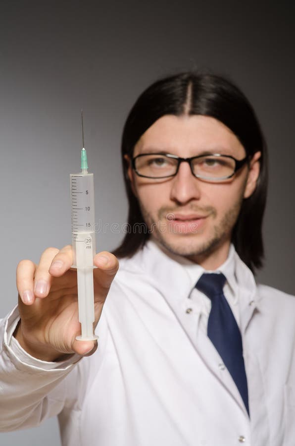 Young Doctor Man with Syringe Against Stock Image - Image of male ...