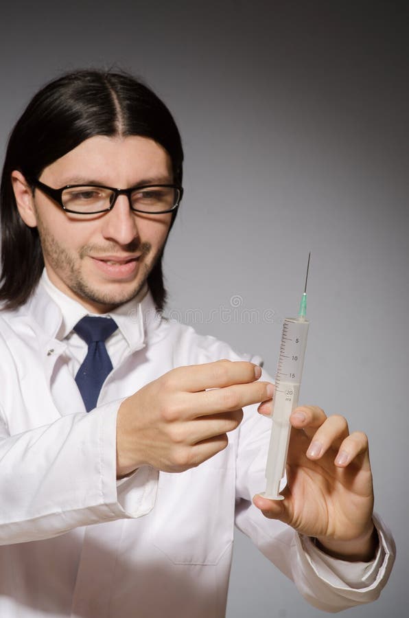 Young Doctor Man with Syringe Against Stock Photo - Image of coat ...